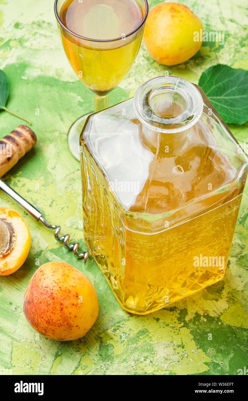 Ripe apricot wine.Alcoholic drink.Fruit wine or liquor in glass Stock ...