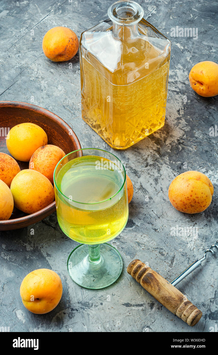 Ripe apricot wine.Alcoholic drink.Fruit wine or liquor in glass Stock ...