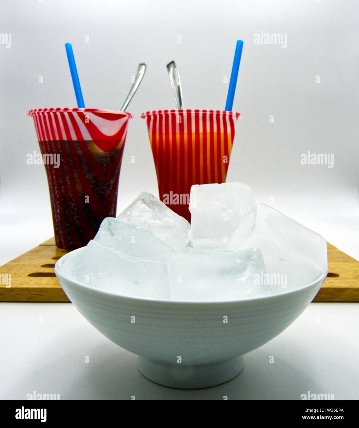 Summer colorful frozen drinks, ice cubes in a jar, white background ...