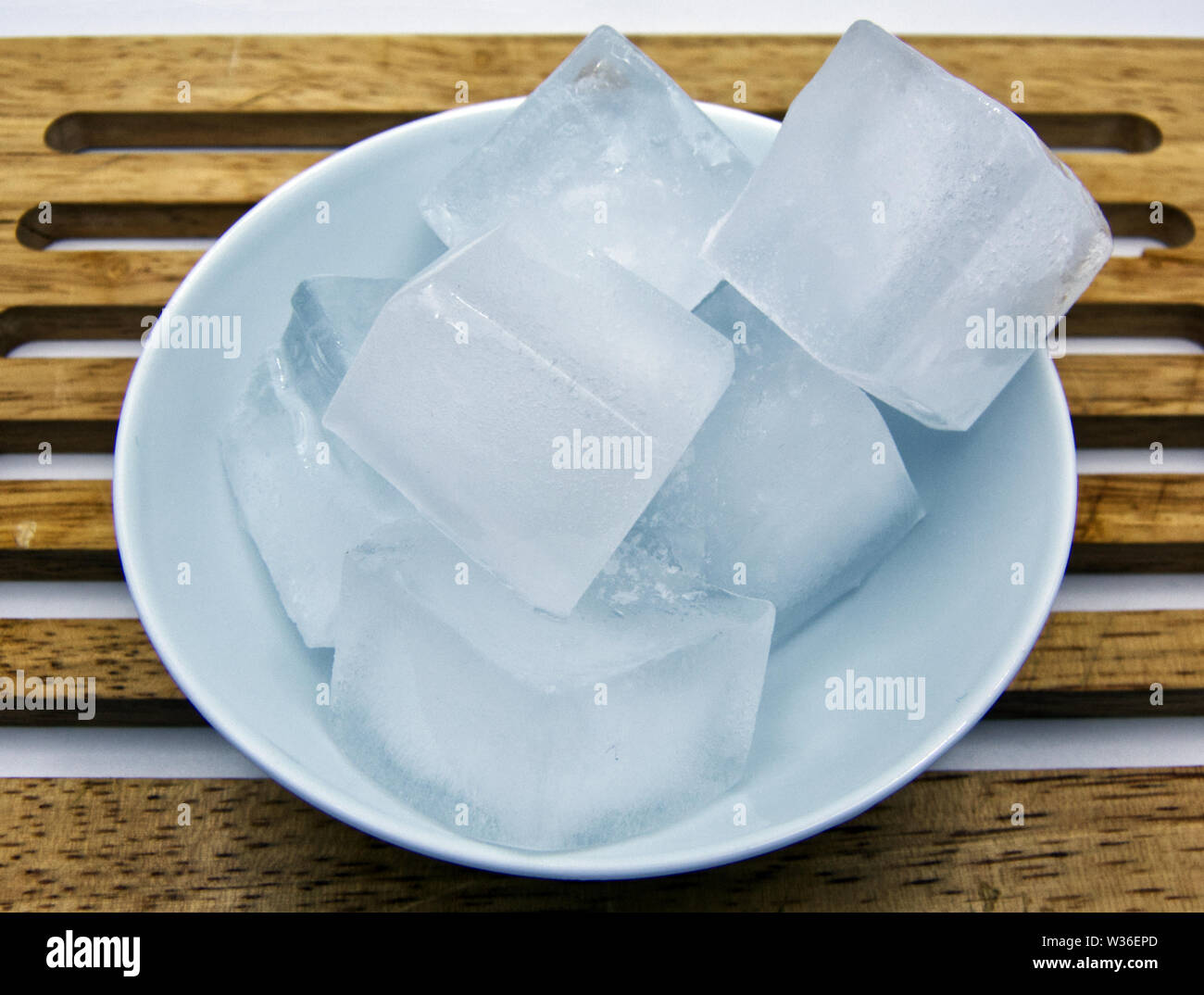 Ice cubes in a ceramic jar Stock Photo - Alamy