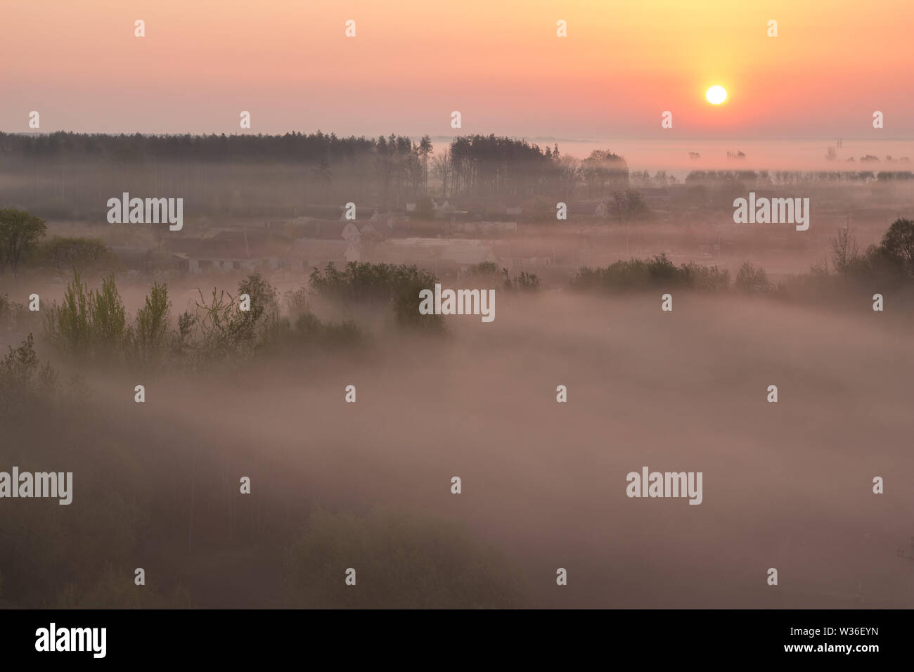 Sun rising over village hi-res stock photography and images - Alamy
