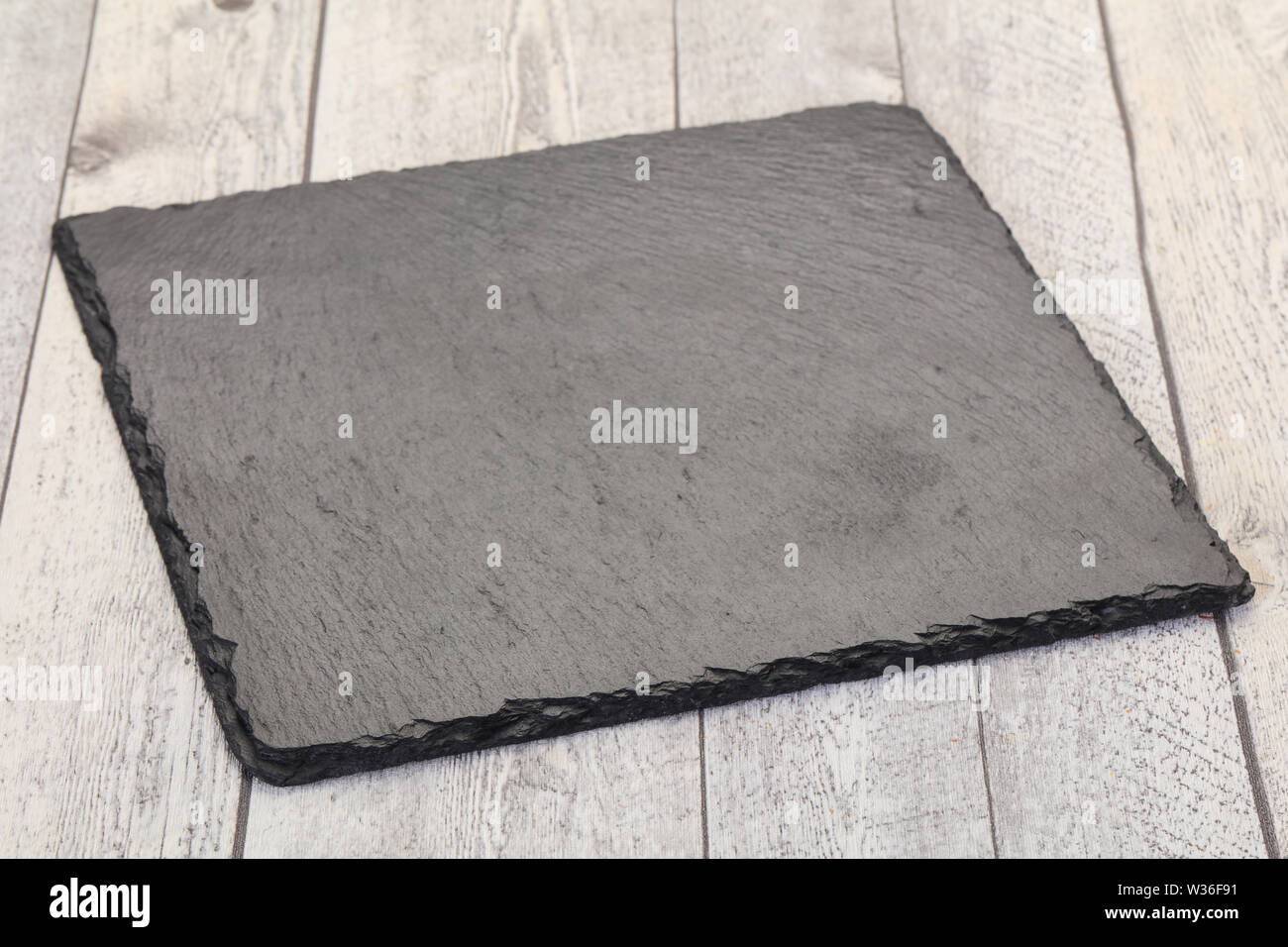 Stone board for serving dishes - kitchenware Stock Photo - Alamy