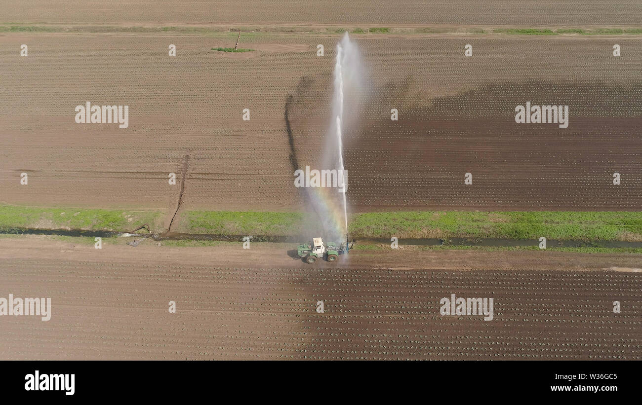 Aerial view of Crop Irrigation using the center pivot sprinkler system ...