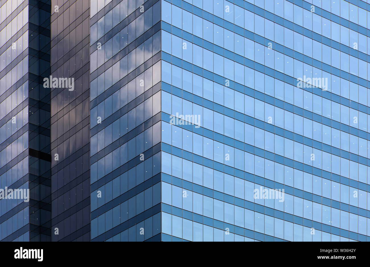blue glass office building facade background view Stock Photo - Alamy