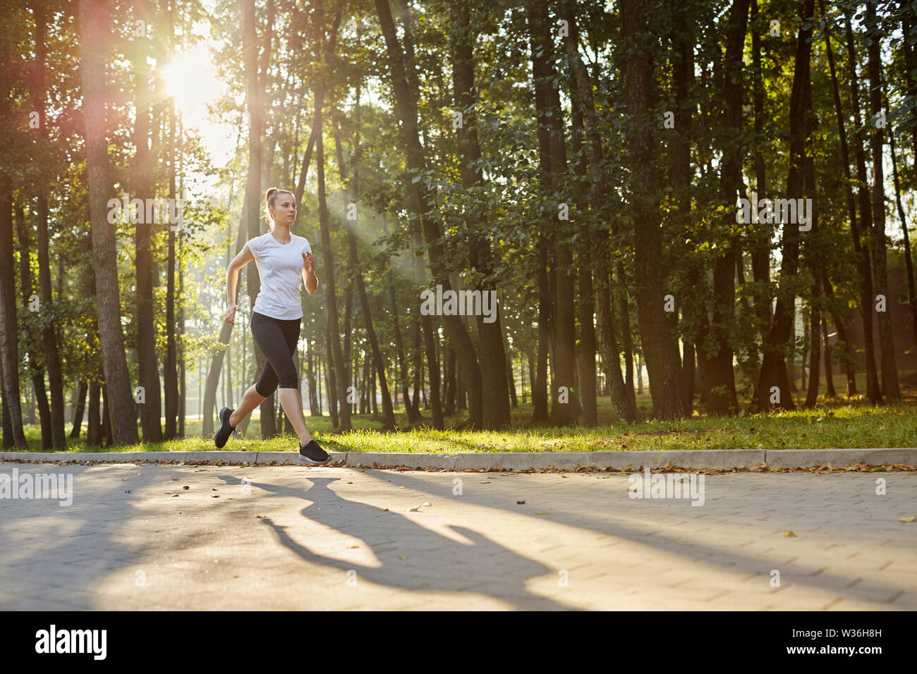 Attractive woman running in morning hi-res stock photography and images ...