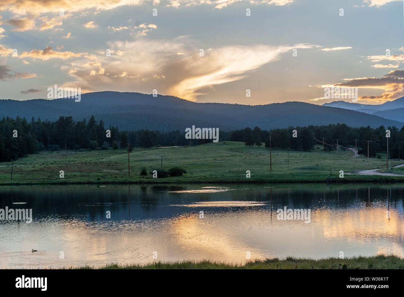 Sunset over a small Lake in the Colorado Rocky Mountains, known as Los ...