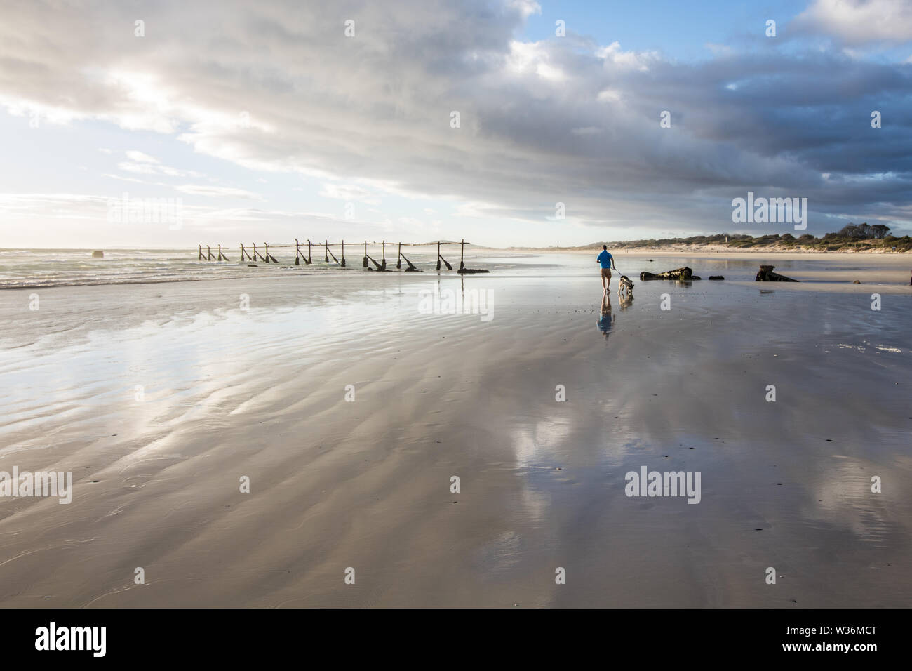 Quiet and peaceful seaside landscape with beach, buildings, clouds and ...