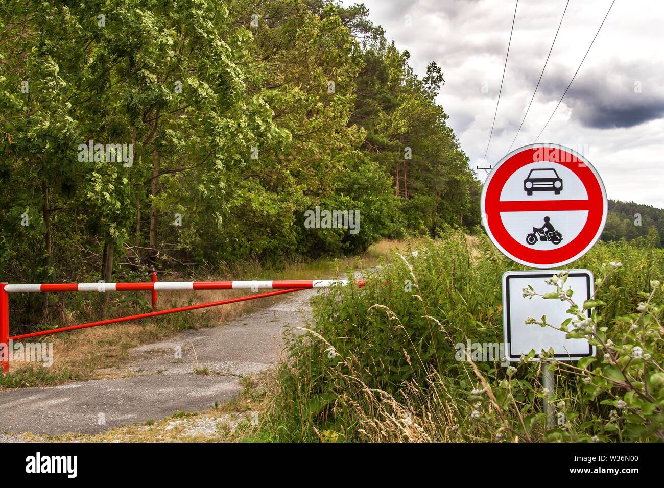 No entry for motor vehicles, cycling only allowed. Storm clouds over ...