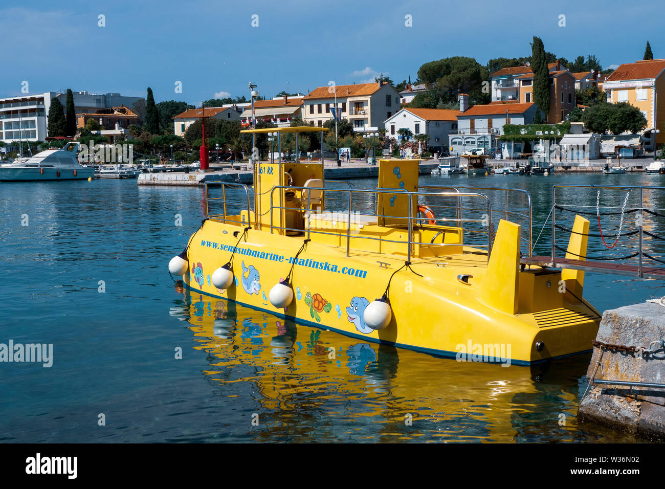 A semi-submarine used for underwater sightseeing tours moored to the ...