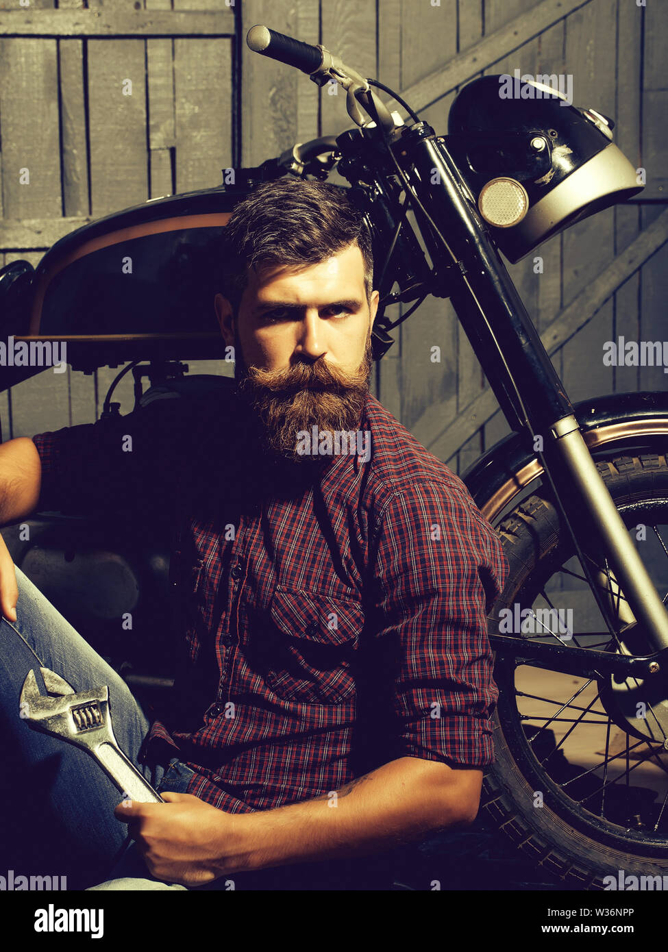 Bearded man hipster biker brutal male with beard and moustache in ...