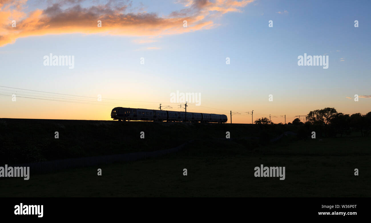 New CAF class 195 train for Arriva Northern Rail making a silhouette at ...