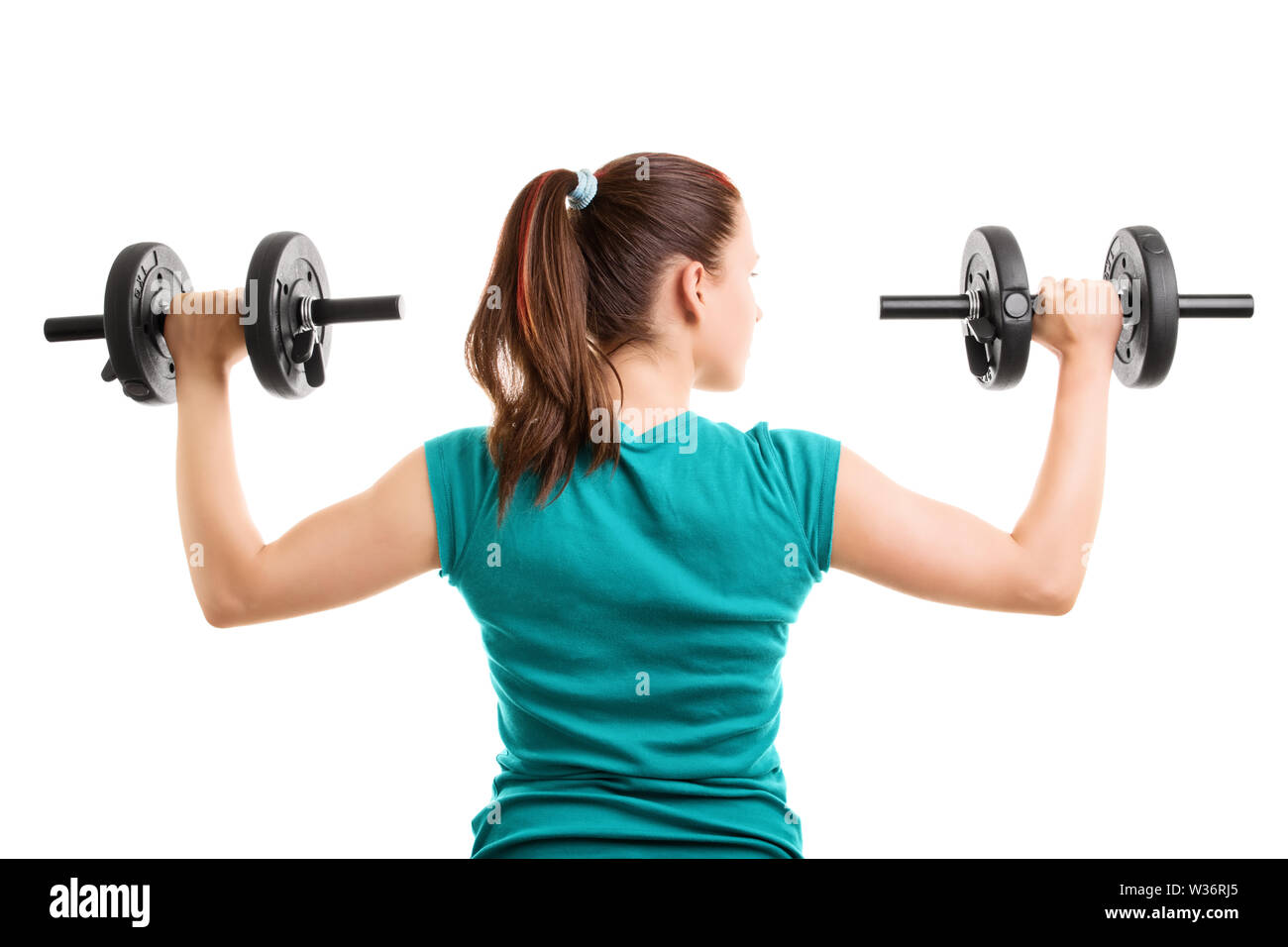Fit young woman doing shoulder raises with dumbbells, isolated on white ...