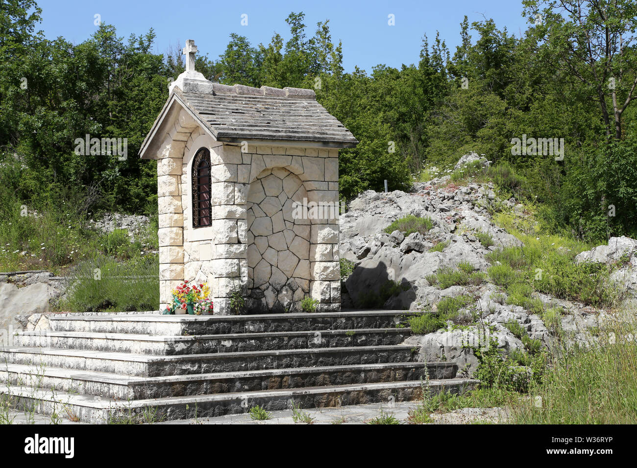 Small chapels built from white stone in Croatia Stock Photo - Alamy