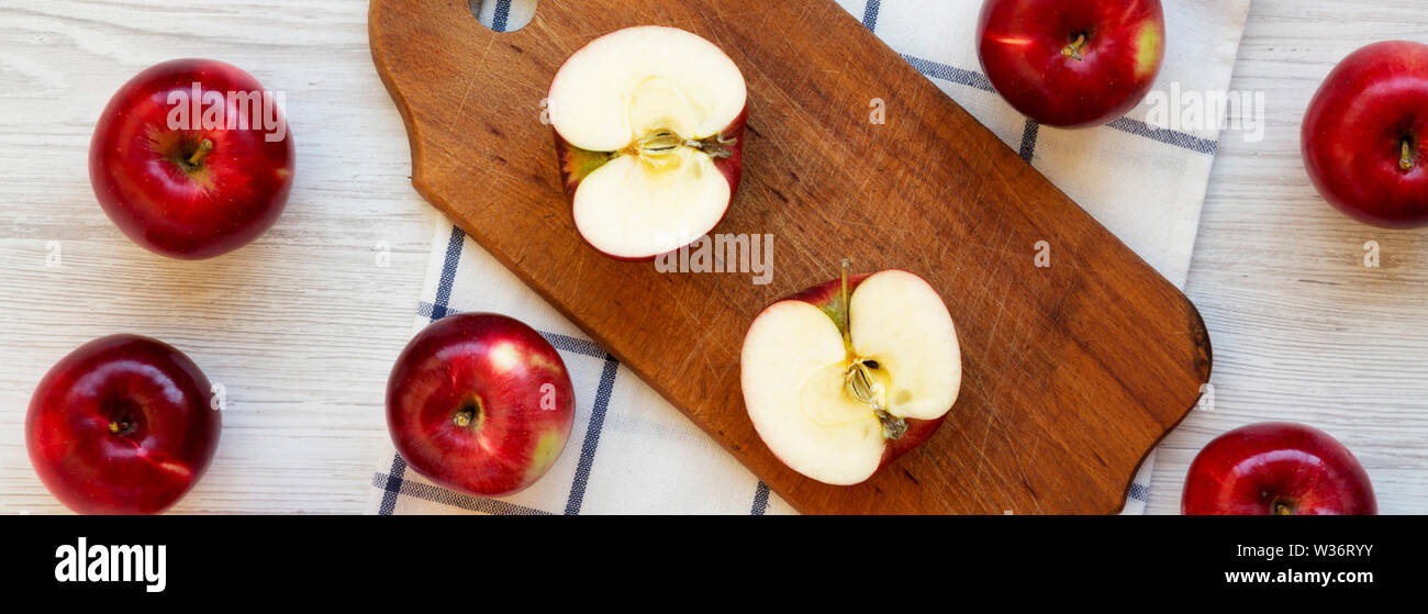 Raw red apples on a white wooden background, top view. Flat lay, from ...