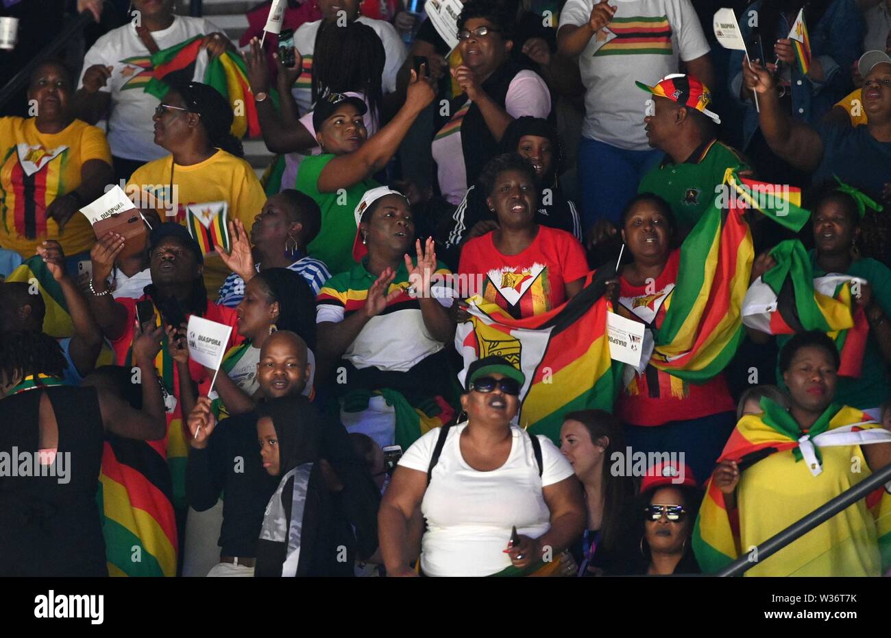 Liverpool, UK. 13th July, 2019. The Zimbabwe fans sing and cheer during ...