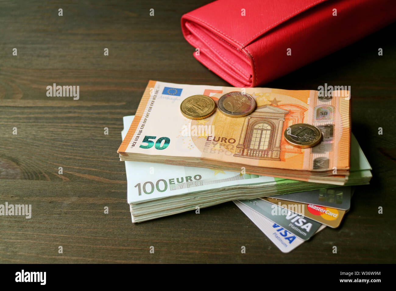 Red wallet euro coins hi-res stock photography and images - Alamy