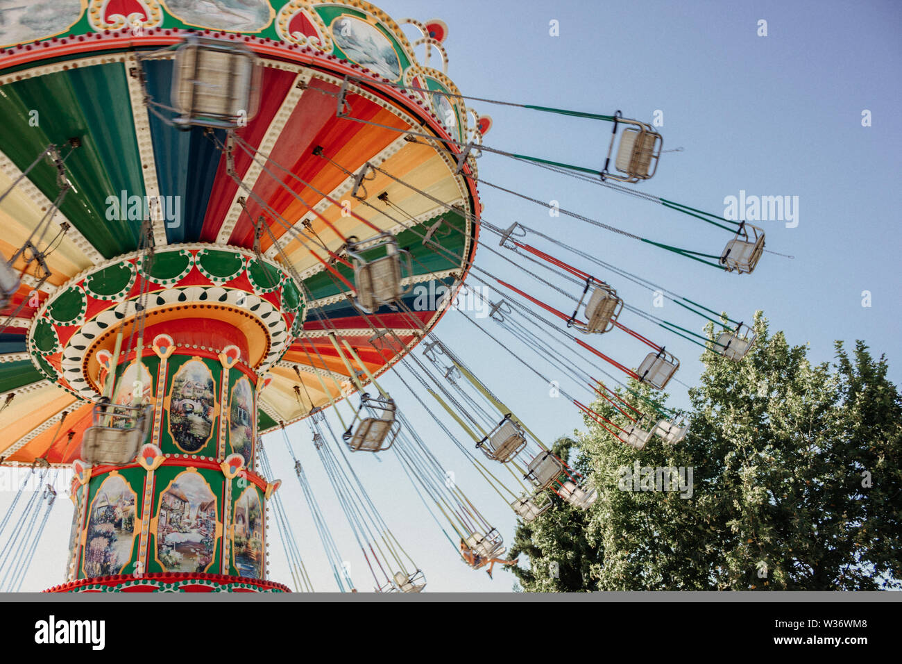 Carousel with chains in an amusement park on summer sunny day Stock ...