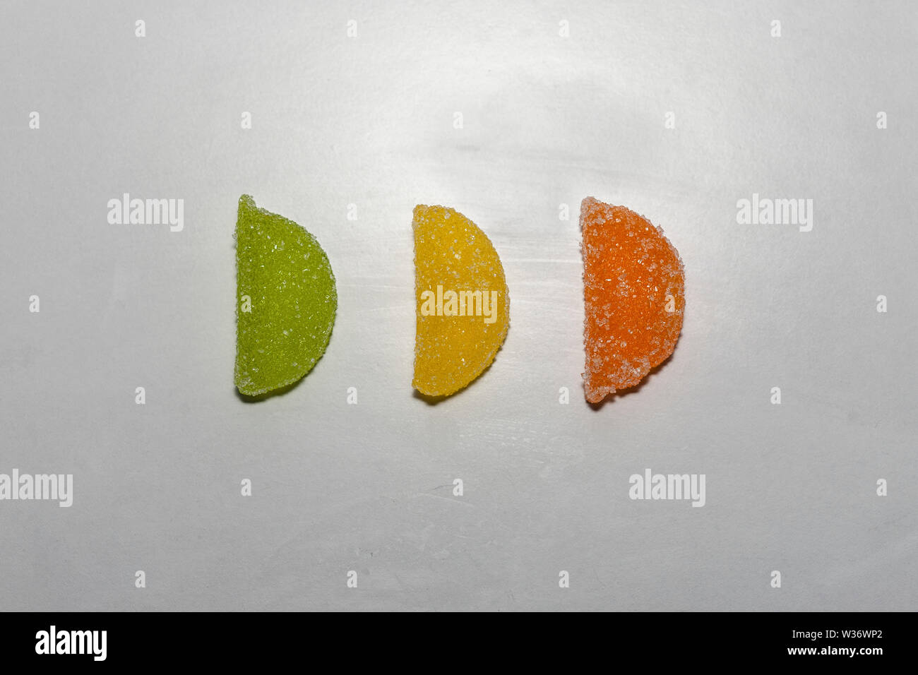 Three Sugar candies in a row Stock Photo - Alamy