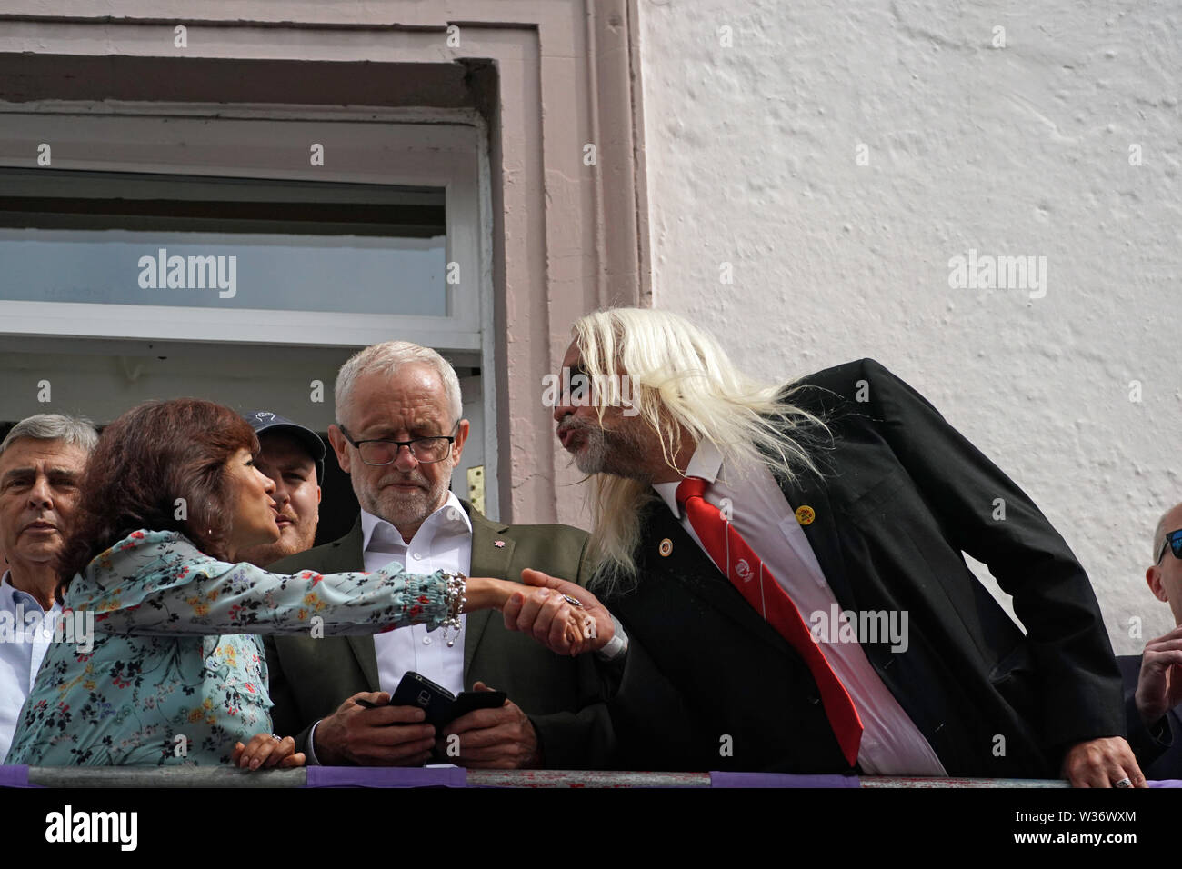 Labour leader Jeremy Corbyn and his wife Laura Alvarez on the balcony ...