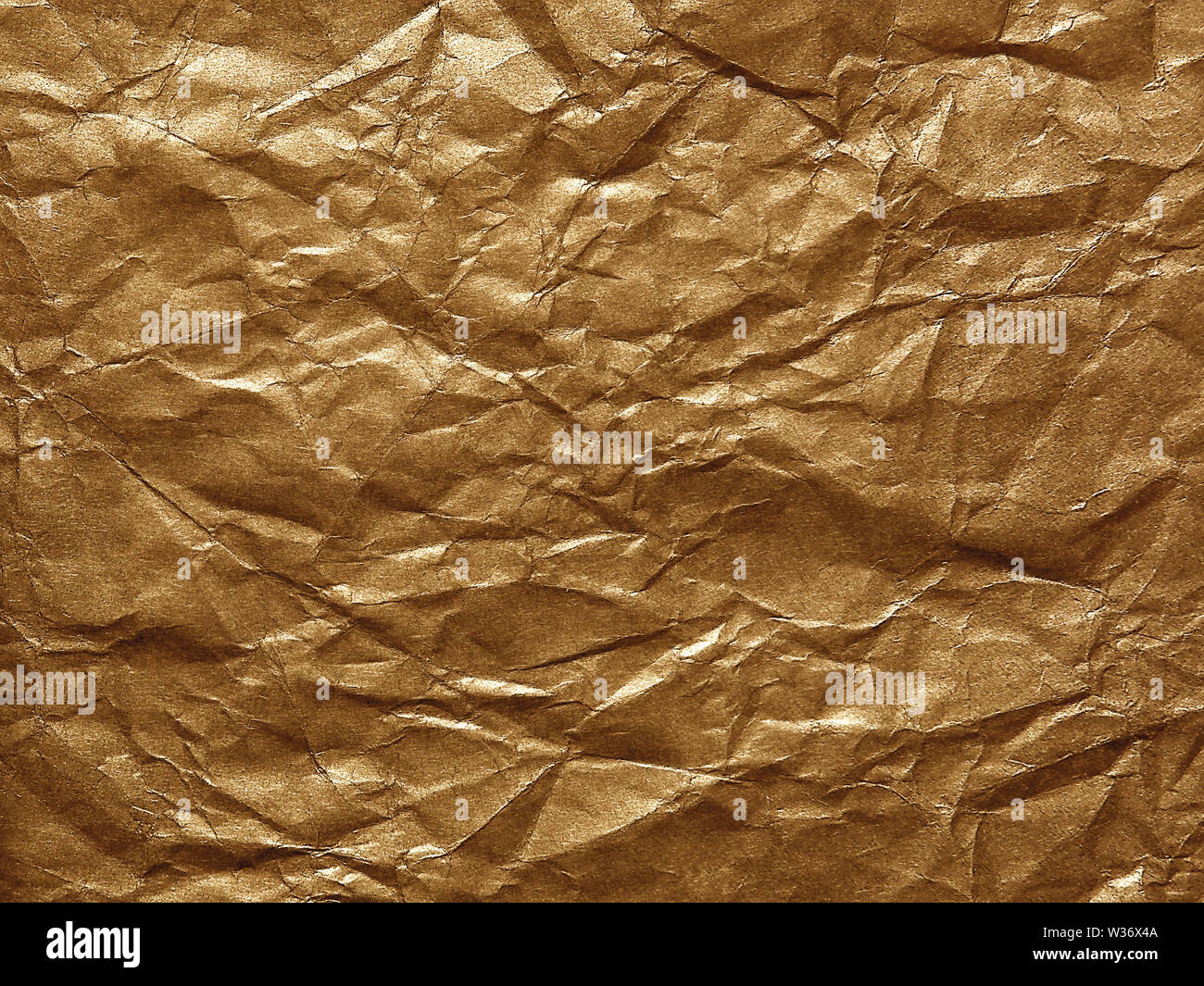 bronze crumpled paper as a background Stock Photo - Alamy