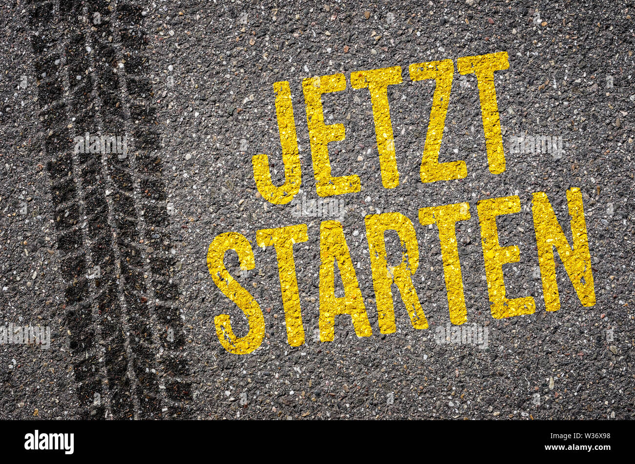 Lane with the German Translation of Start now - Jetzt starten Stock ...