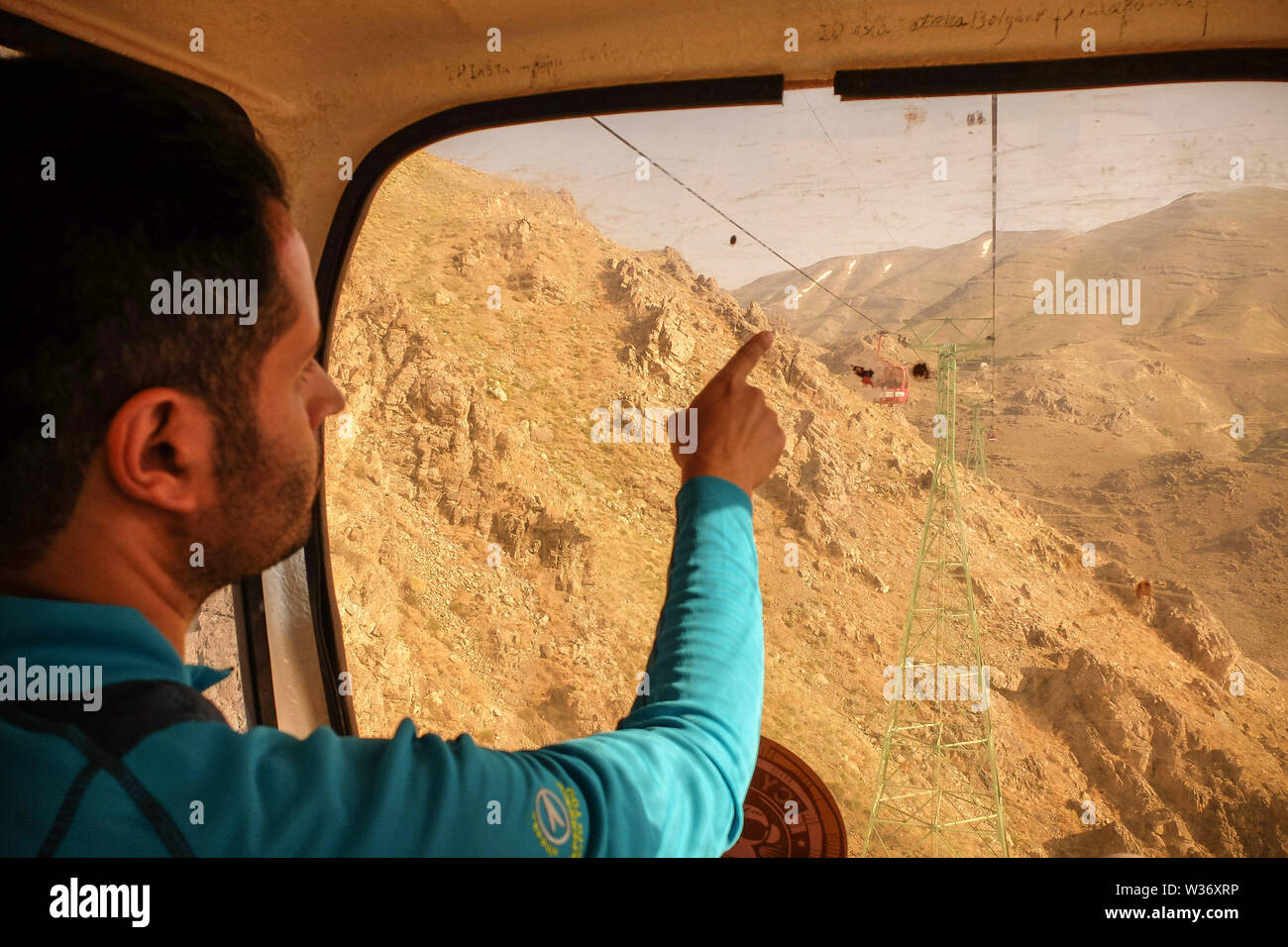 Tehran, Iran. 12th July, 2019. People ride in Tochal Telecabin in north ...