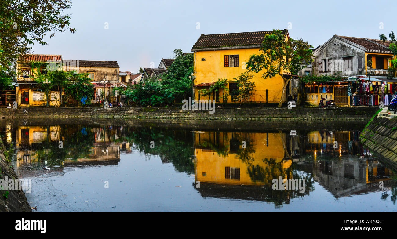 Hoi An, Vietnam - Jul 19, 2018. Old buildings with the river in Hoi An ...