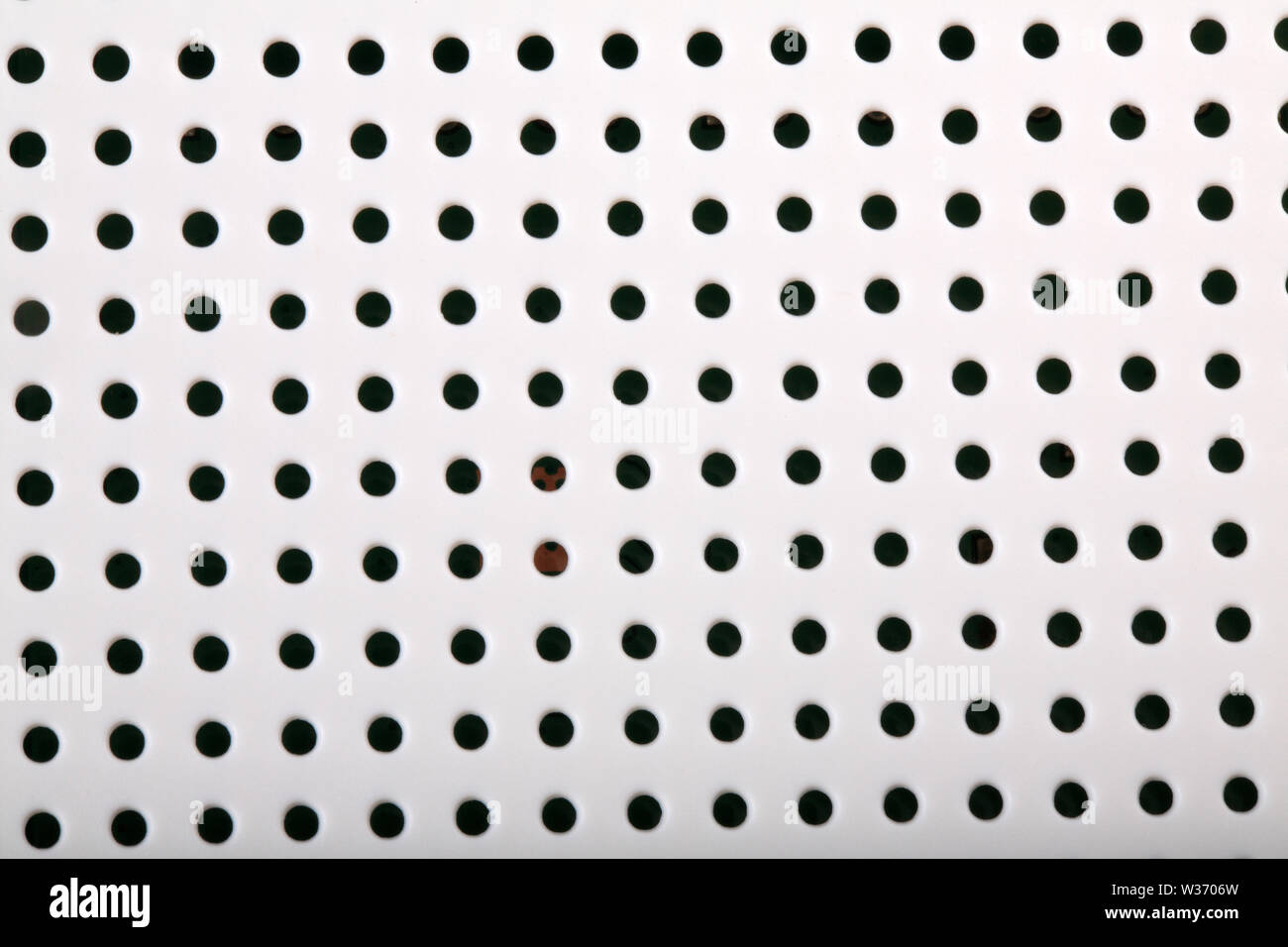 plastic background with holes Stock Photo - Alamy