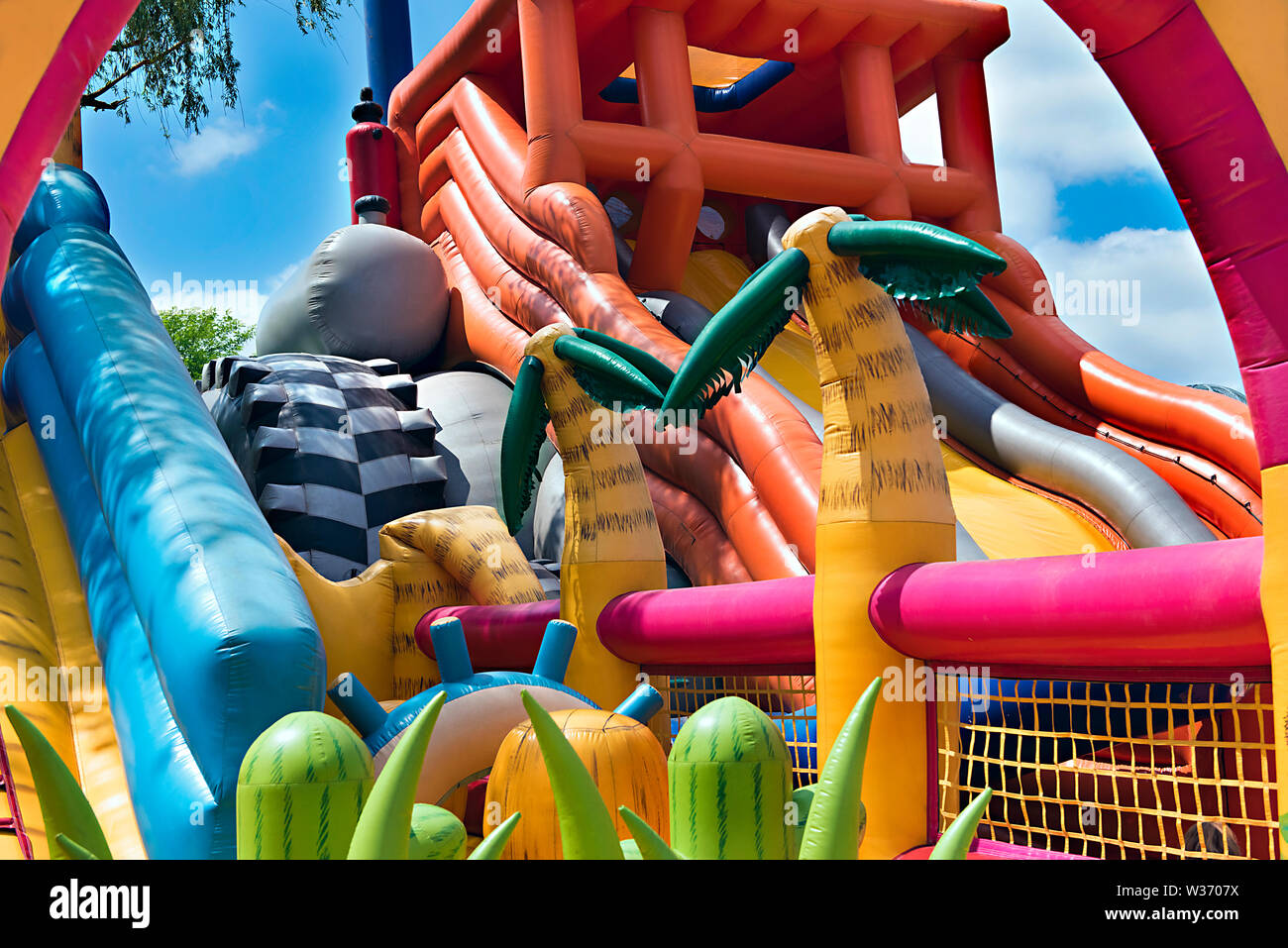 children's inflatable attraction with a springboard Stock Photo - Alamy