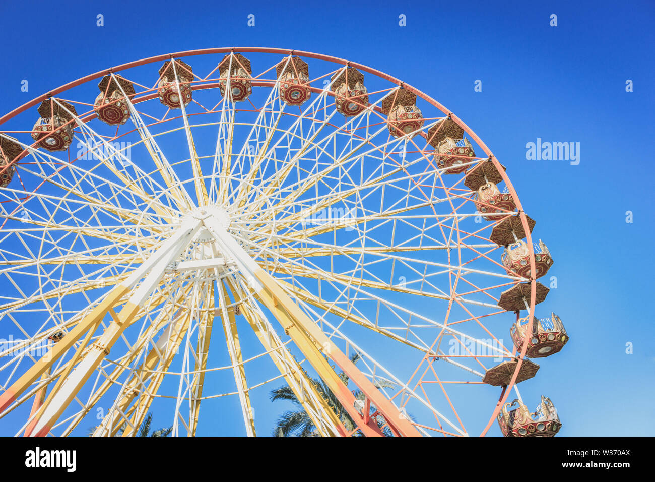 Ferris wheel in an amusement park at the summer Stock Photo - Alamy