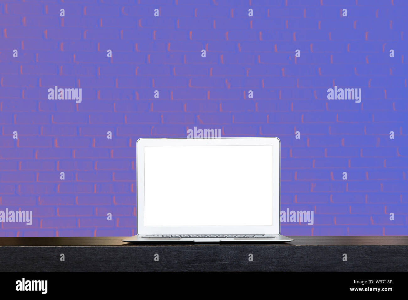 Isolated mockup image of laptop with black wood and computer with ...