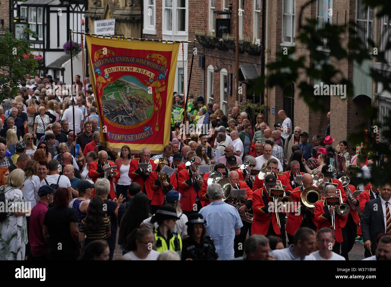 Bands and banners parade through Durham during the Durham Miners' Gala ...
