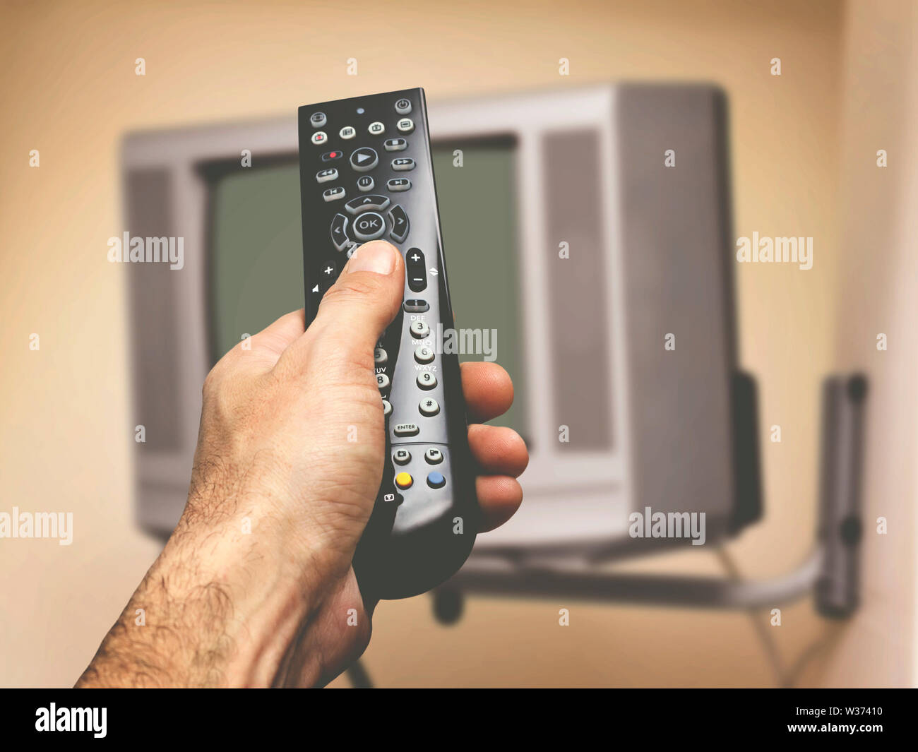 remote control in man's hand Stock Photo - Alamy