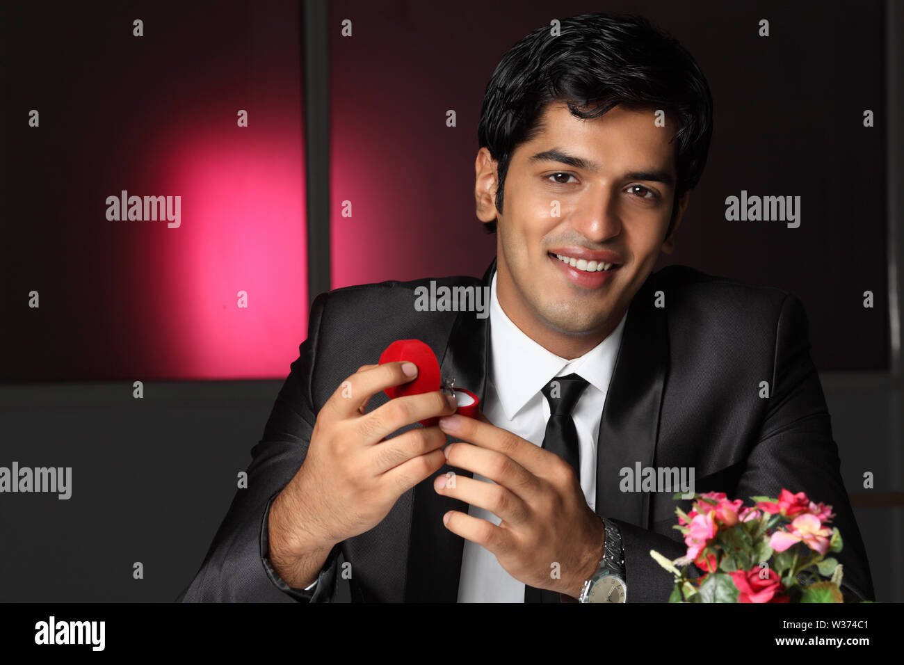 Man holding engagement ring Stock Photo - Alamy