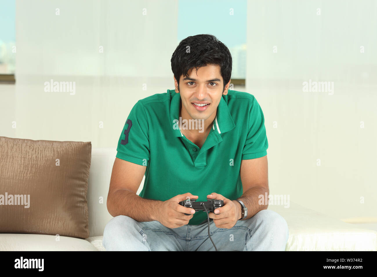 Man playing video game Stock Photo - Alamy
