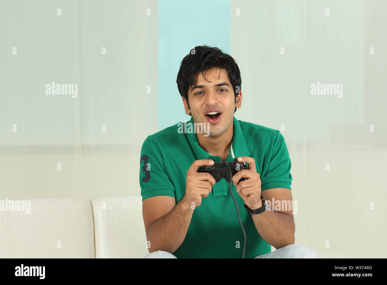 Man playing video game Stock Photo - Alamy