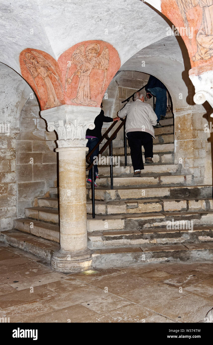crypt, stone steps, pillars with Corinthian capitals, angels playing ...