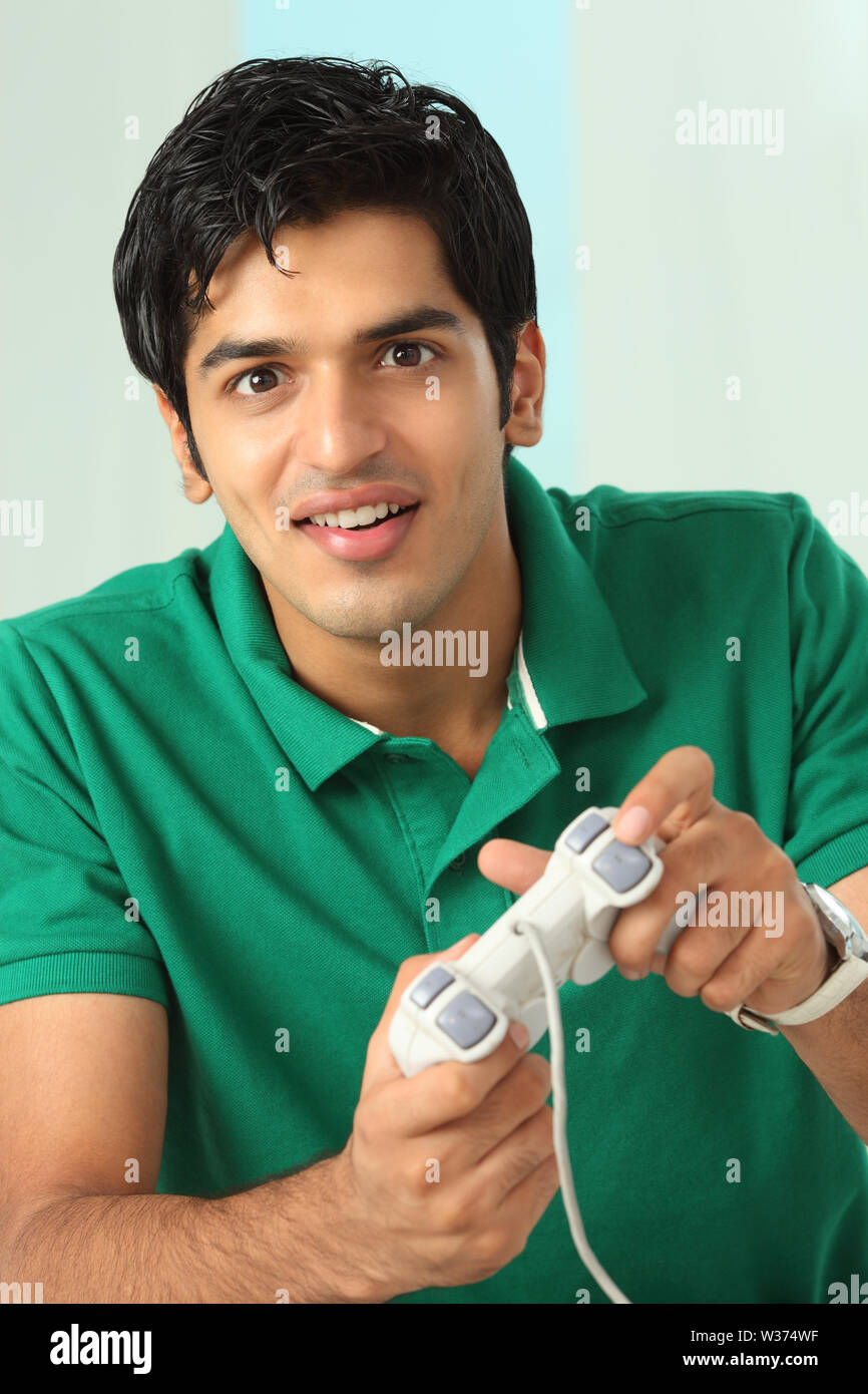 Man playing video game Stock Photo - Alamy