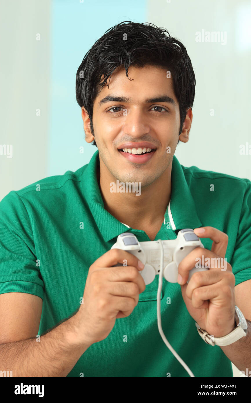 Man playing video game Stock Photo - Alamy