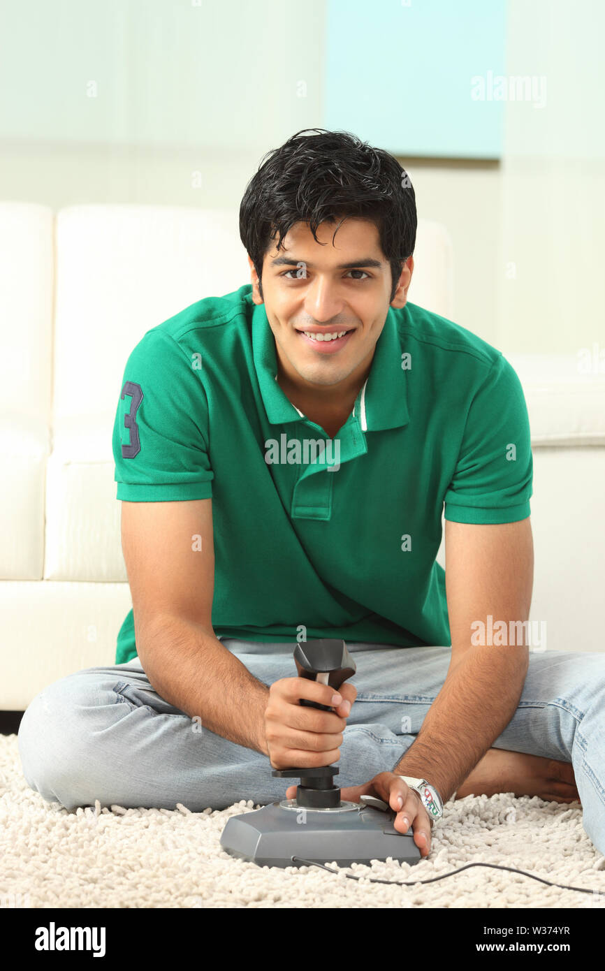 Man playing video game Stock Photo - Alamy