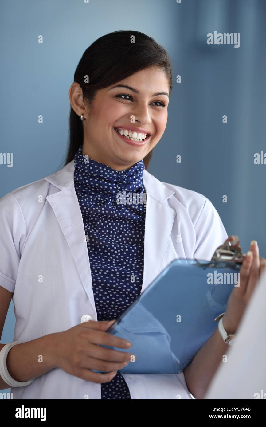 Female doctor smiling Stock Photo - Alamy