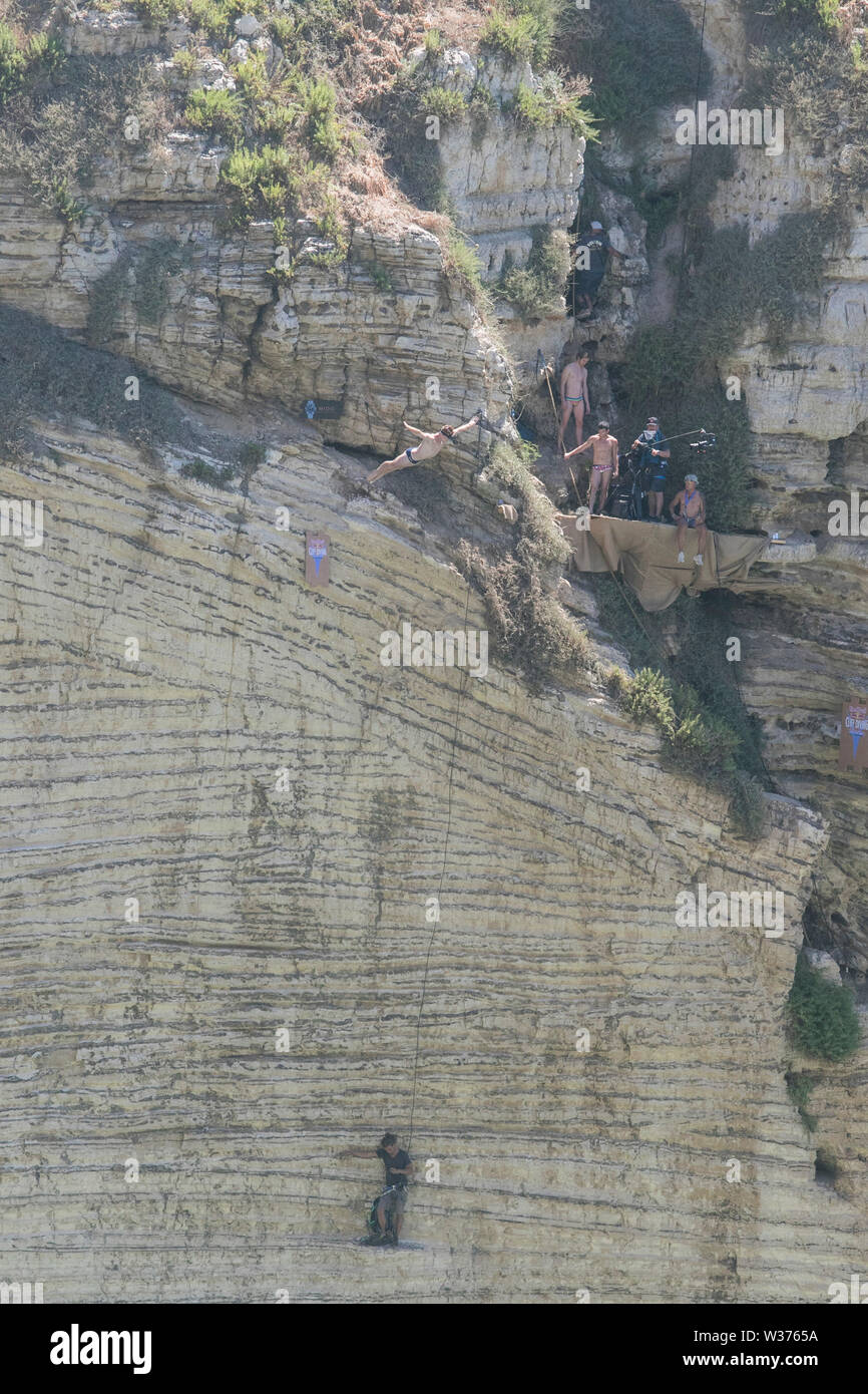 Beirut, Lebanon. 13th July 2019. A competitor jumps off 'The Pigeon ...