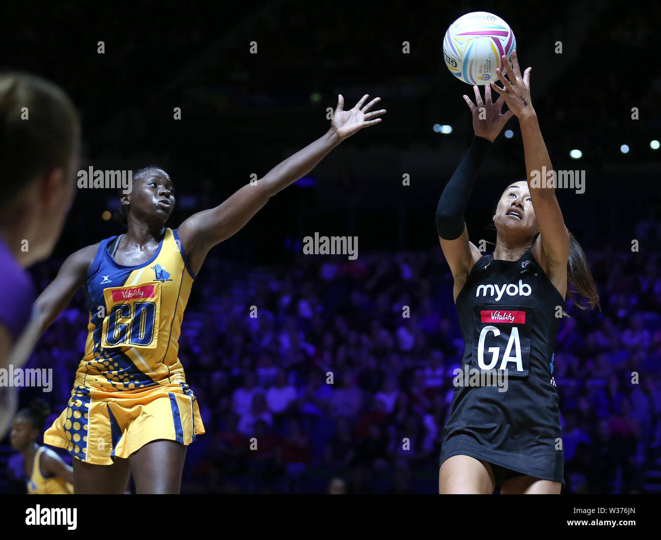 New Zealand's Maria Folau (right) and Barbados' Rhe-Ann Niles-Mapp battle for the ball during ...