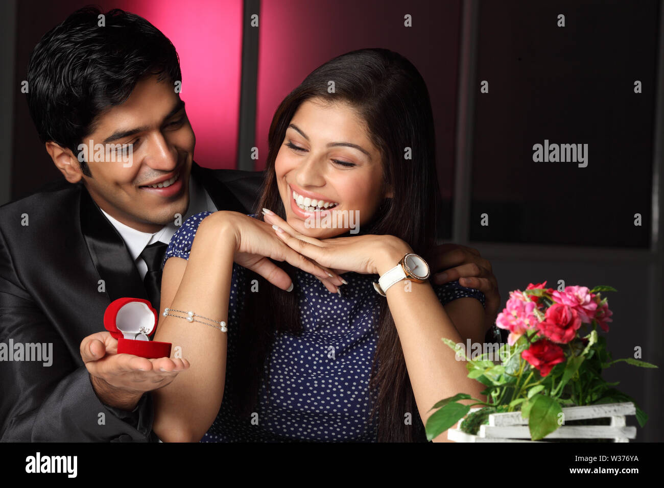 Hand giving engagement rings hi-res stock photography and images - Alamy
