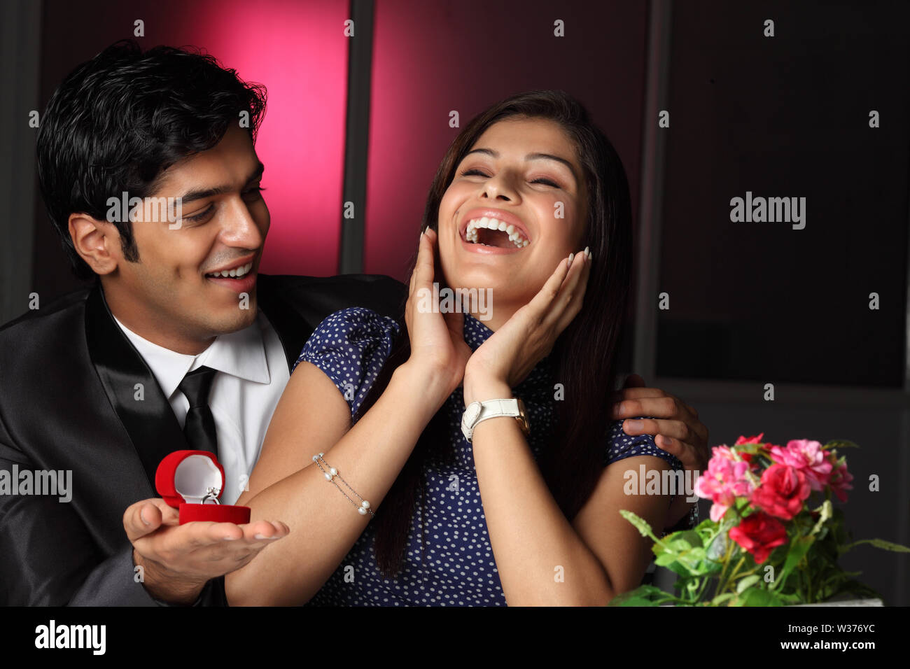 Man giving engagement ring to a woman Stock Photo - Alamy