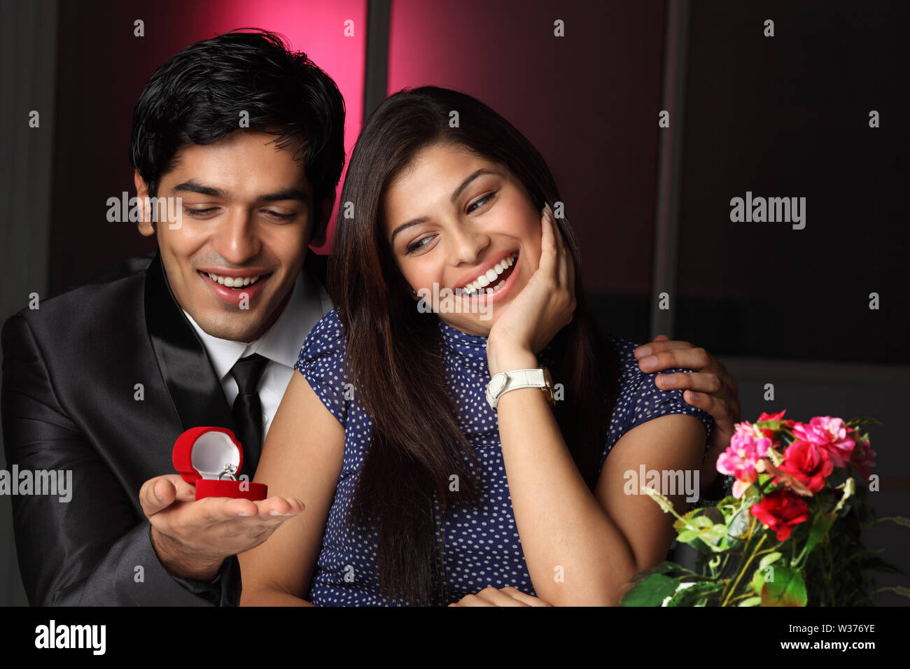 Man giving engagement ring to a woman Stock Photo - Alamy