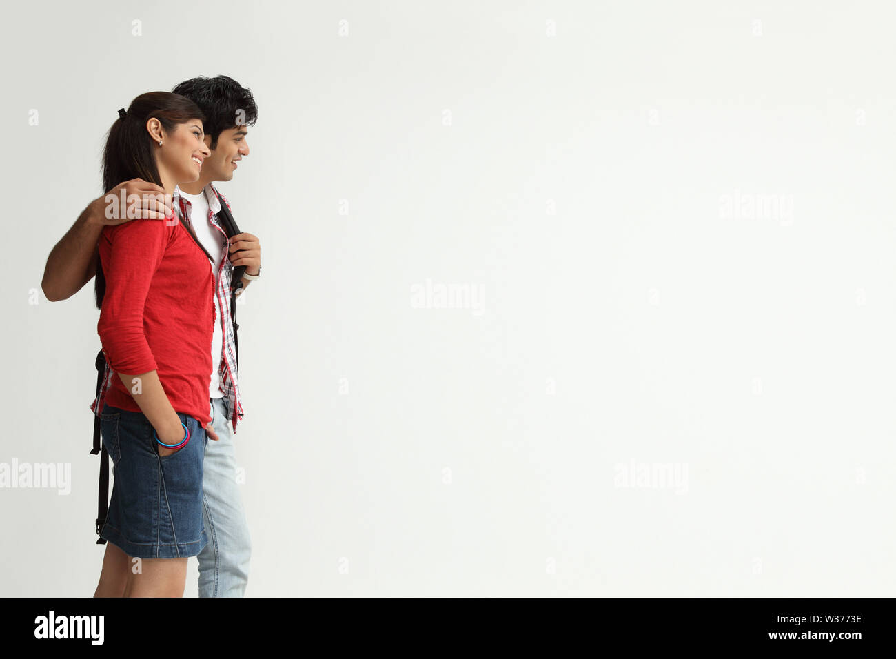 Side profile of a couple smiling Stock Photo - Alamy