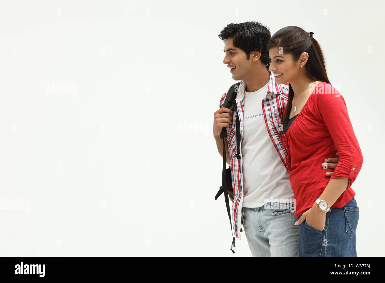 Side profile of a couple smiling Stock Photo - Alamy