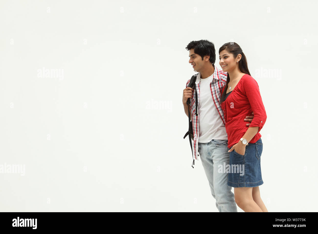 Side profile of a couple smiling Stock Photo - Alamy