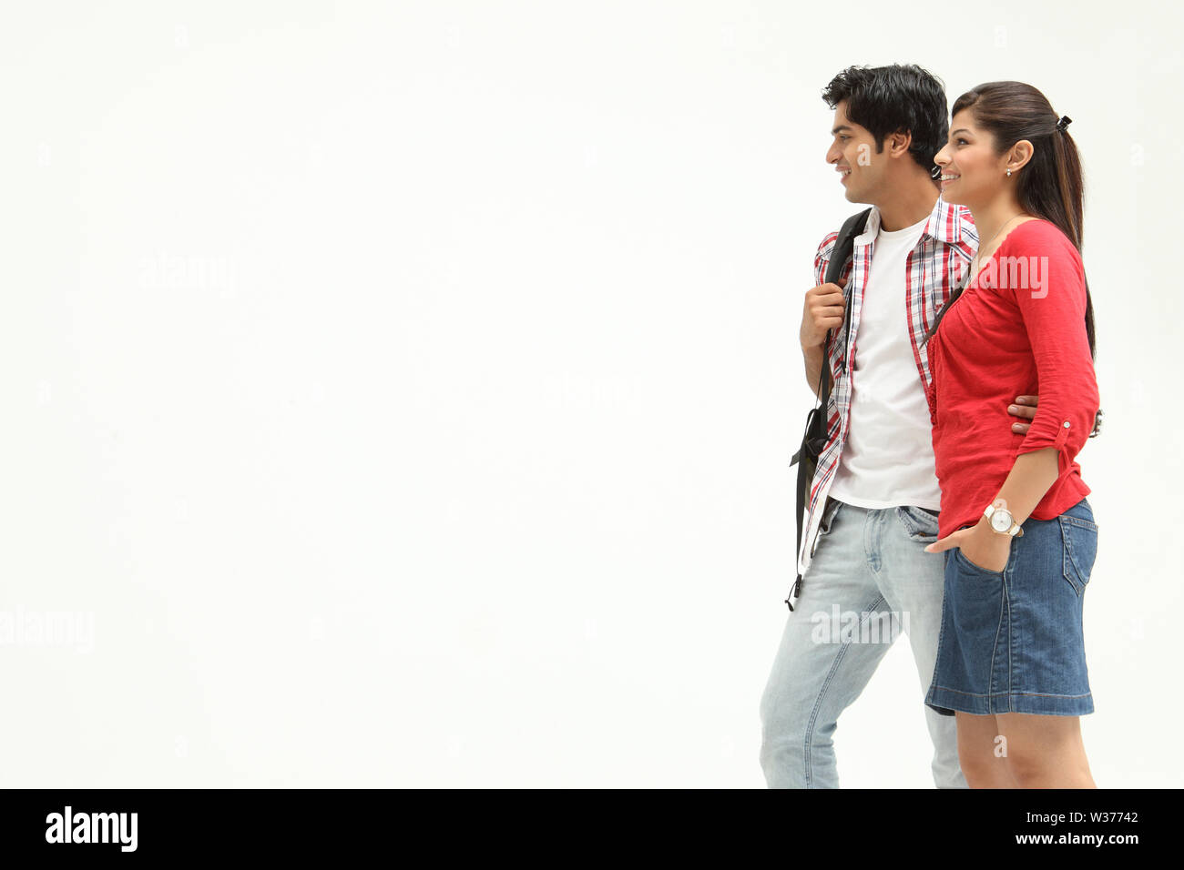 Side profile of a couple smiling Stock Photo - Alamy